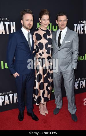 Michelle Monaghan, Aaron Paul and Hugh Dancy arrive at the premiere of ...