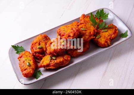 Fritters prepared with flour and pumpkin. Traditional Spanish recipe ...