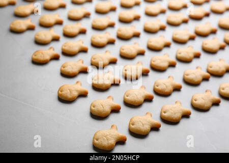 Delicious goldfish crackers on grey table, flat lay Stock Photo - Alamy