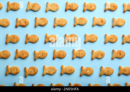 Delicious goldfish crackers on light blue background, flat lay Stock ...