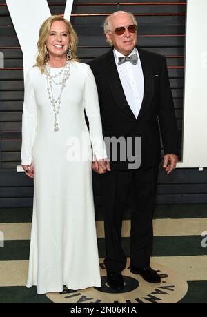 Jimmy Buffett, left, and Jane Slagsvol arrives at the Vanity Fair Oscar ...