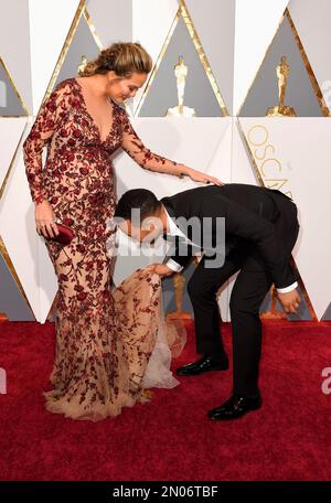 Christine Teigen, left, and John Legend arrive at the Oscars on Sunday ...