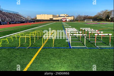 Different kinds of Hurdles set up on a field for strength and agility ...