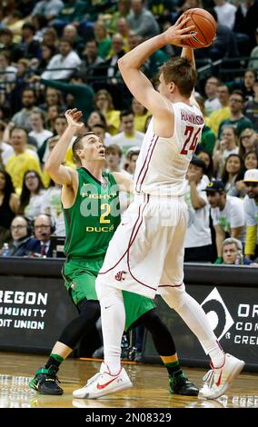 Washington State's Josh Hawkinson, right, shoots against Arizona's ...