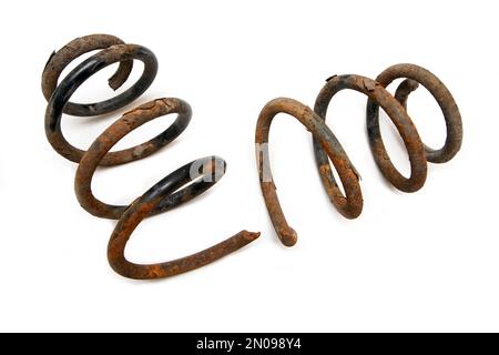 The old rusty broken coiled spring from the car suspension isolated in ...