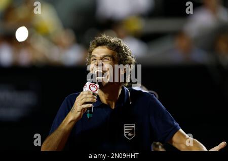 Brazilian former tennis player Gustavo 'Guga' Kuerten, left, greets ...