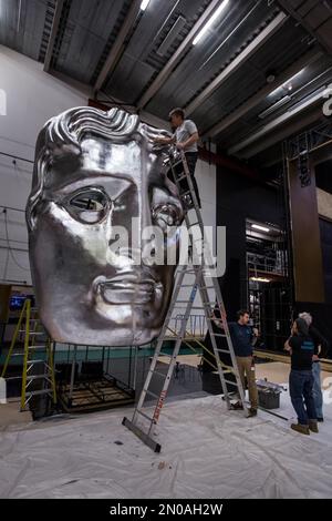 Set builders work on a giant replica of the British Academy Films ...