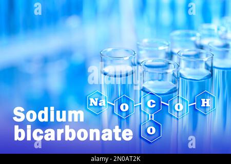 Text Sodium bicarbonate with soda formula and laboratory glassware on ...