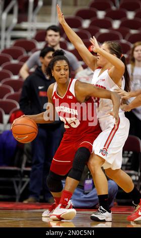 Ohio State's Cait Craft, left, goes up for a shot against Wisconsin's ...
