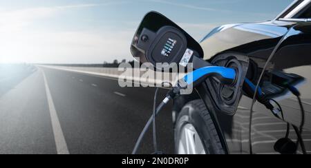 Close up of electric car inlet with a connected charging cable Stock ...