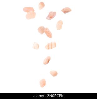 Pink himalayan salt falling on white background Stock Photo - Alamy