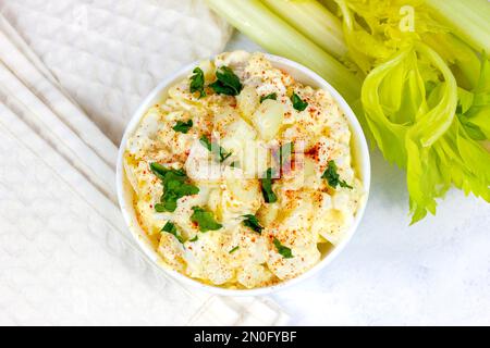 Bowl with creamy potato salad on wooden table Stock Photo - Alamy