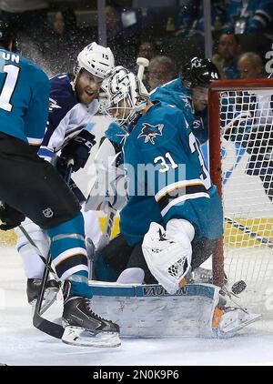 Winnipeg Jets' Matt Halischuk (15) runs into Colorado Avalanche's Zach ...