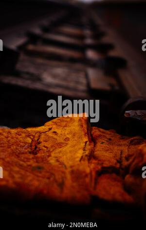 railroad tracks with rust on rock background Stock Photo - Alamy