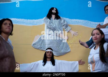 Jesus behind bars in prison. Wooden figure of Jesus in the church ...