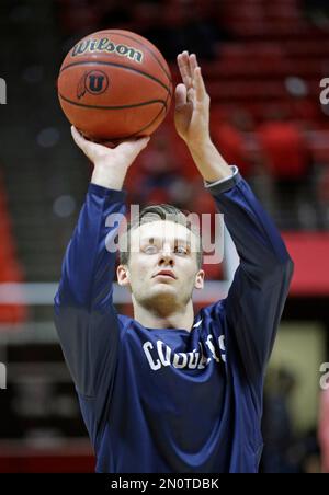 BYU guard Kyle Collinsworth (5) shoots as Utah forward Jakob Poeltl (42 ...