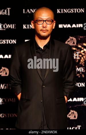 Chinese director Guan Hu poses on the red carpet at the 52nd Golden ...