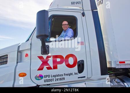 XPO Logistics CEO Brad Jacobs hands out cake to employees during launch ...