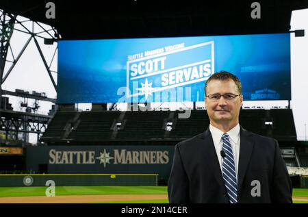 New Seattle Mariners manager Scott Servais poses for a photo with his ...