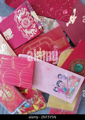 A pile of red packet containing gift of money packed inside given as ...