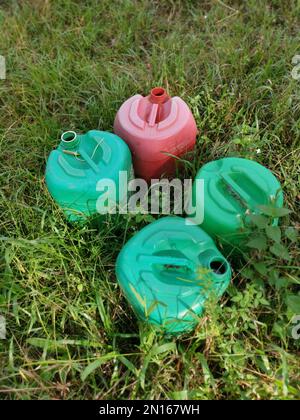 colorful pesticide containers left at the oil palm plantation Stock ...