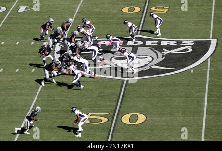 Gold 50-yard line markers are shown at O.co Coliseum during an NFL ...