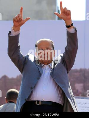 Supporters of Christian leader Michel Aoun hold his picture and Free ...