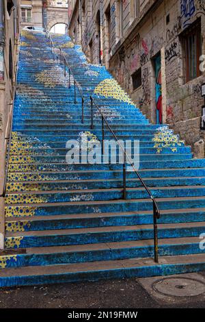 LYON, FRANCE, February 4, 2023 : Painted stairs of Passage Mermet, a ...