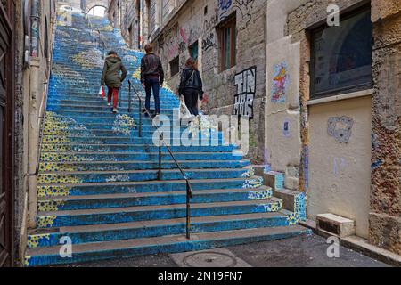 LYON, FRANCE, February 4, 2023 : Painted stairs of Passage Mermet, a ...
