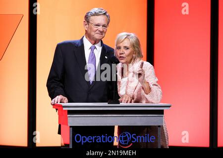 Dr. Bill Magee, left, and Kathy Magee speak on stage at the 2015 ...