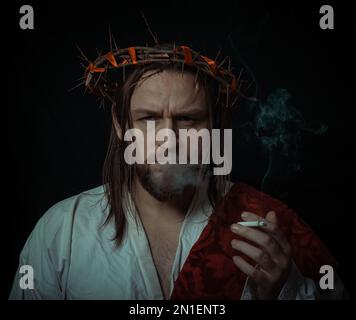 Jesus Christ smokes a cigarette wearing a crown of thorns and white ...