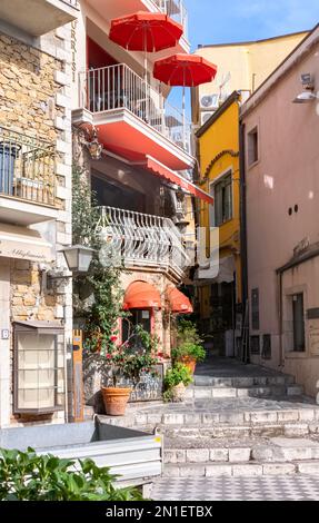 Castelmola, Sicily, Italy, Bar Turrisi with bright red parasols over ...