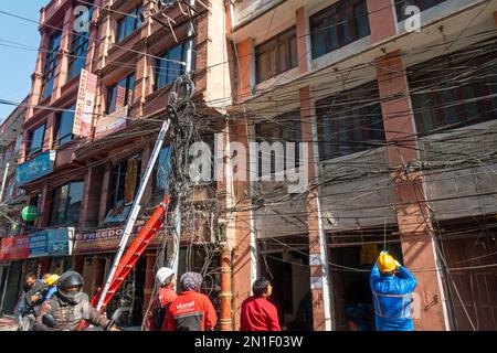 Kathmandu Nepal Worker fixing intricate communication wires cables ...