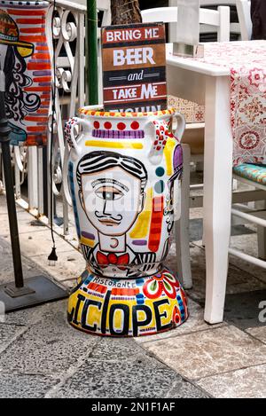 Colourful traditional large ceramic flower pots with painted faces ...