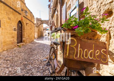 View of Rhodes sign in narrow cobbled street, Old Rhodes Town, UNESCO ...