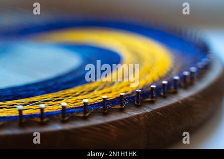 Colored thread mandala on a wooden board with nails. Mandala Moon ...