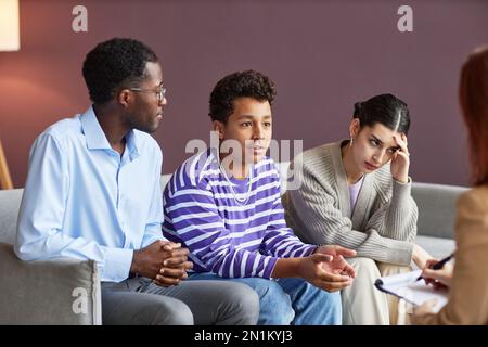 Teenage boy complaining to psychologist about his parents Stock Photo ...