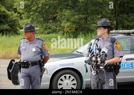 Virginia State Police Trooper David Creath dons his gas mask aboard ...
