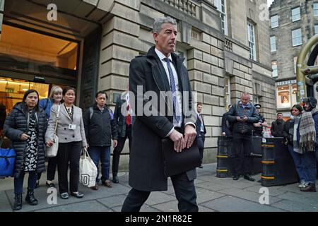 Family members of Bennylyn Burke, sister Shela Aquino (left) and father ...