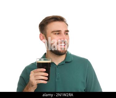 Handsome man with cold kvass on yellow background. Traditional Russian ...