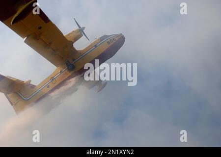 Croatian fire workers controls fire during forest fire on the Peljesec ...