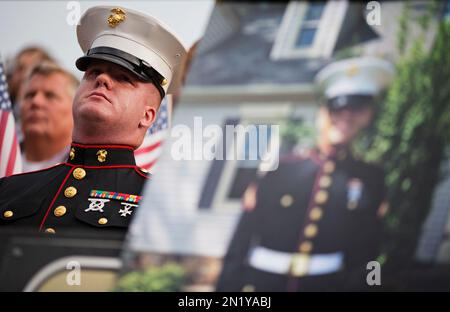 A tear rolls down the cheek of Sgt. Benjamin Tranter, a former ...