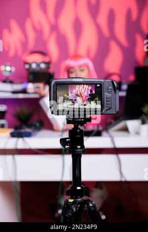 Asian vlogger advertising white box at camera reviewing product while ...