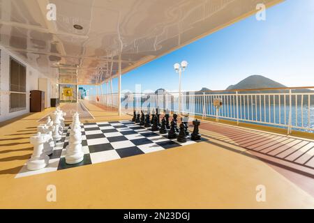A large, giant size checker or chess board with black and white chess ...