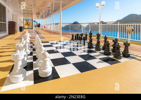 A large, giant size checker or chess board with black and white chess ...
