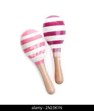 Cute baby with maracas on white background Stock Photo - Alamy