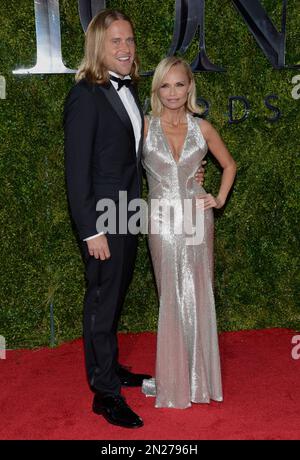Andrew Pruett, left, and Kristin Chenoweth arrive at the 69th annual ...