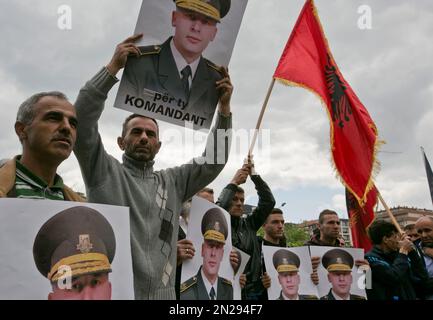 Ethnic Albanians hold photos of former guerrilla commander Sylejman ...