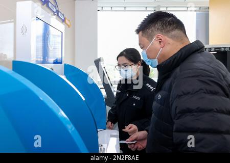 ZHOUSHAN, CHINA - FEBRUARY 7, 2023 - A staff member of the Exit and ...