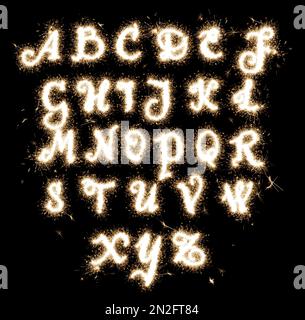 Set with letters made of sparkler on black background Stock Photo - Alamy